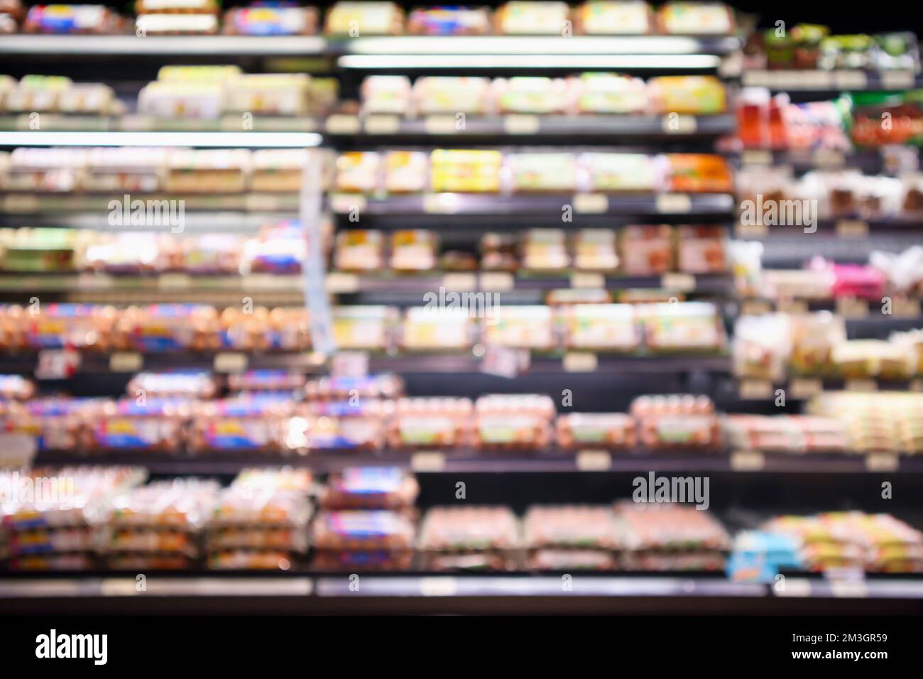 Abstract supermarket grocery store with egg shelves blurred defocused ...