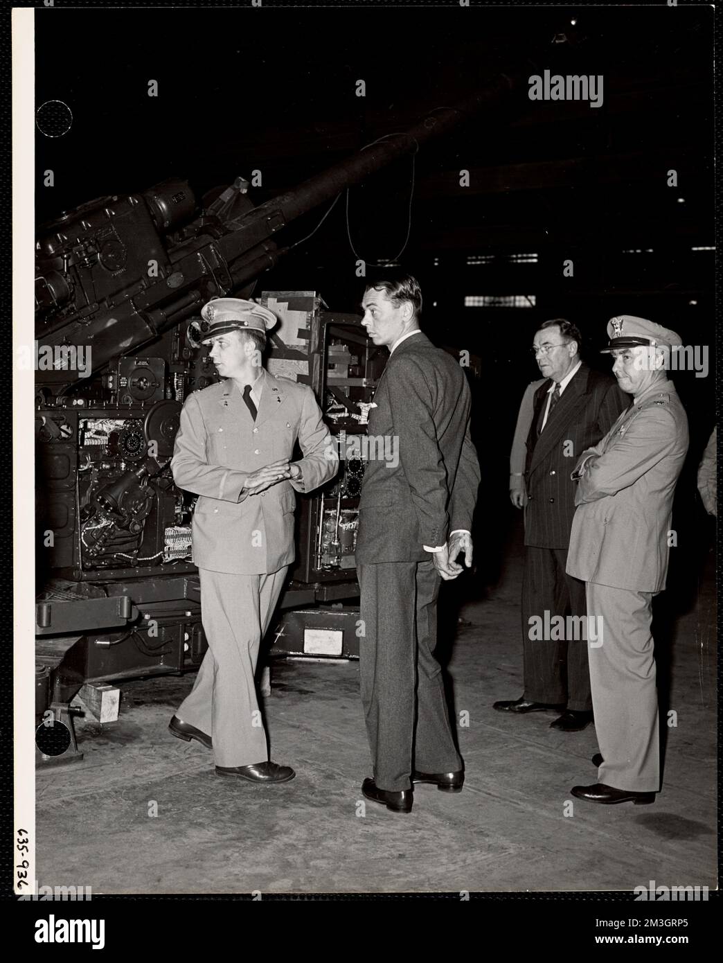 Men and military officers inspecting ordnance , Ordnance industry ...