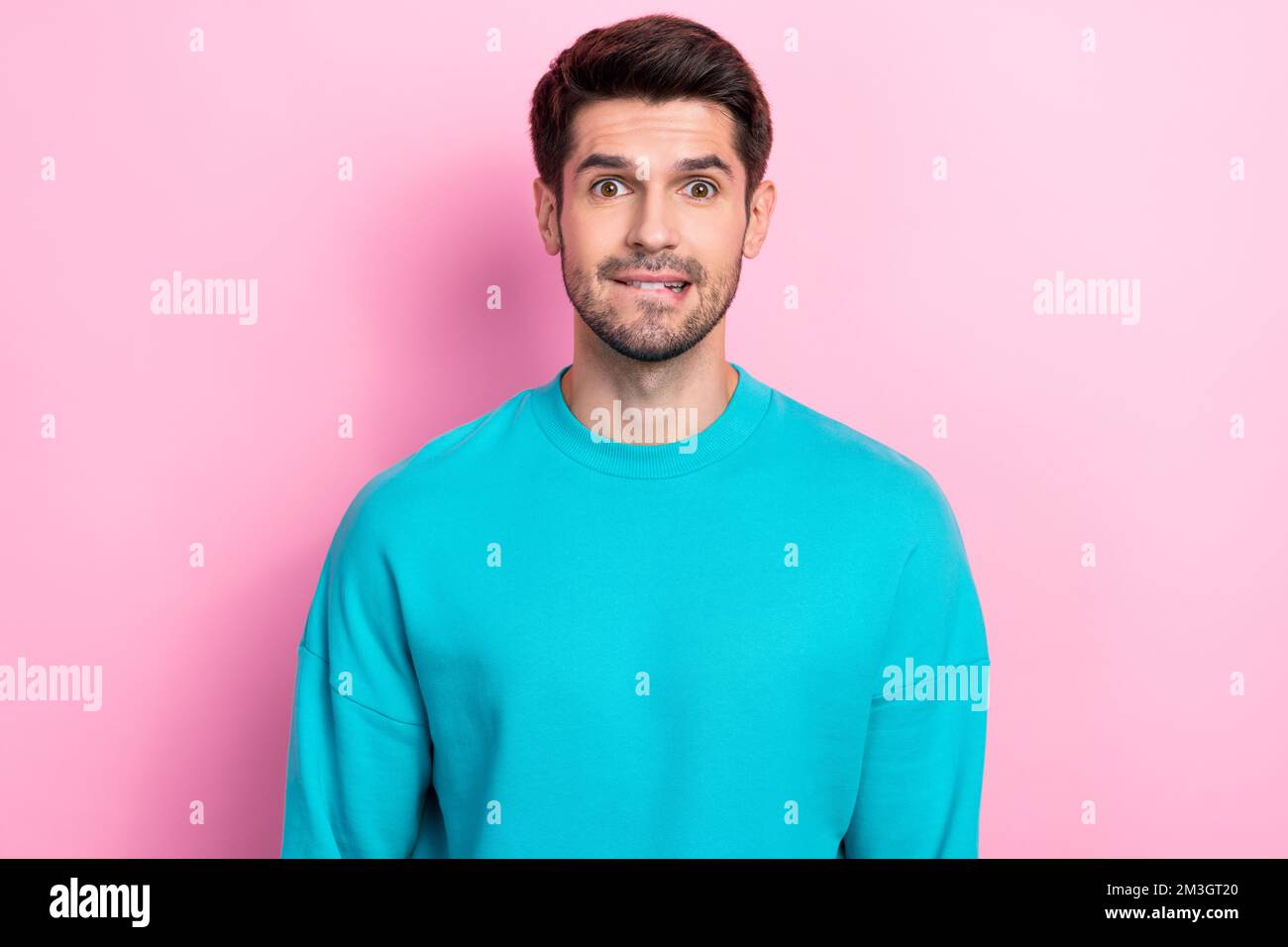 Photo portrait of attractive young guy bite lips confused nervous wear ...