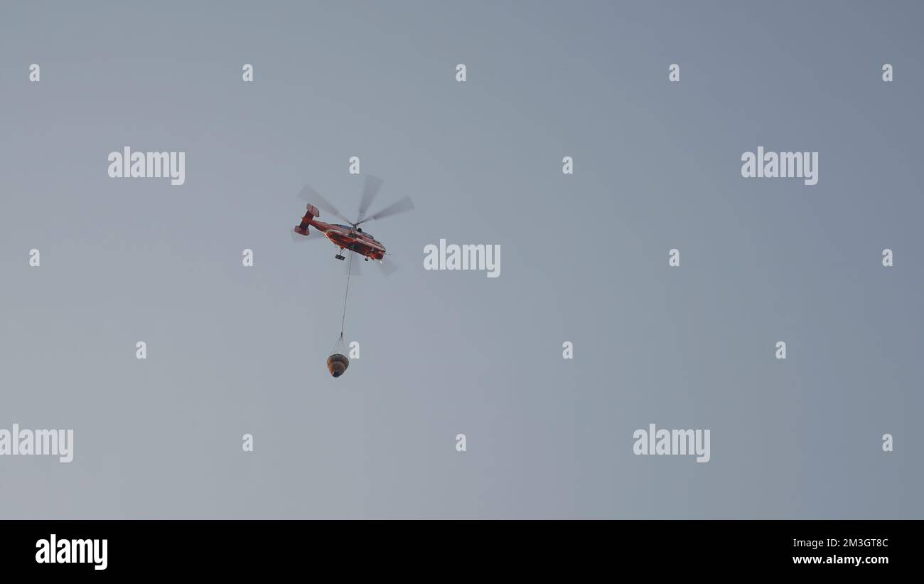 Bottom view of rescue helicopter. Action. Helicopter is flying with ...