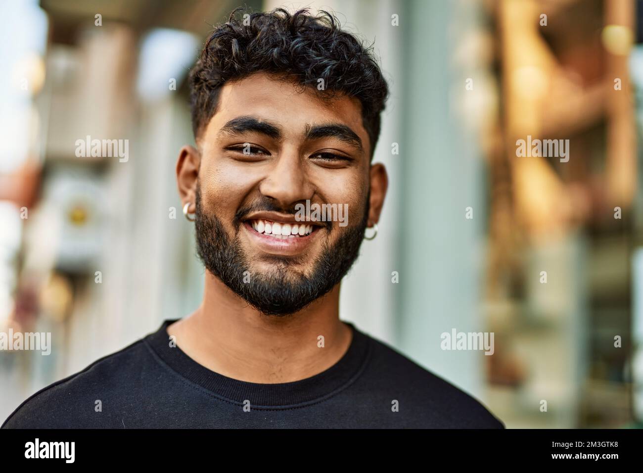 Young arab man smiling confident at street Stock Photo - Alamy