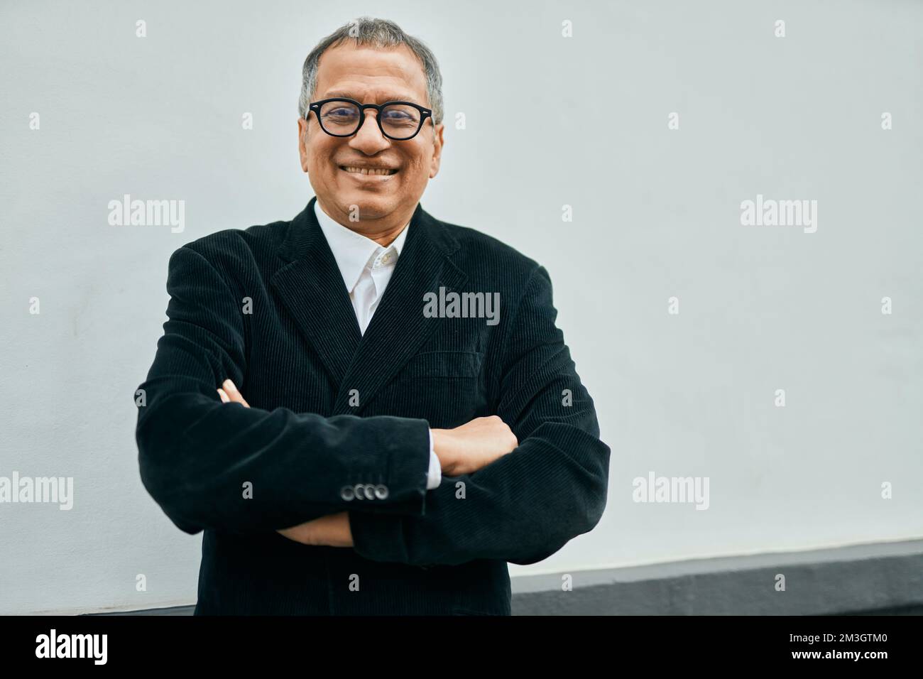 Middle age southeast asian man smiling confident with crossed arms ...