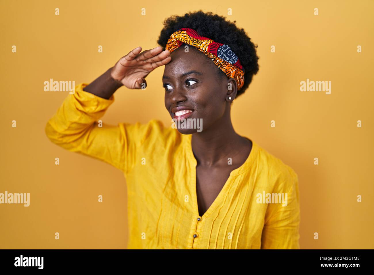 African young woman wearing african turban very happy and smiling ...