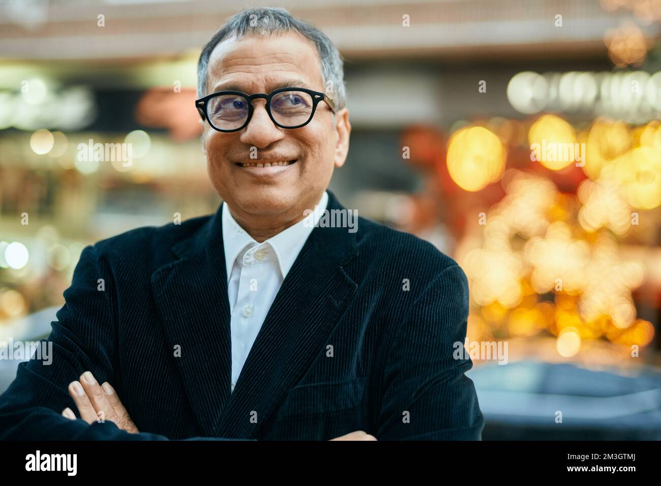 Middle age southeast asian man smiling confident with crossed arms at ...