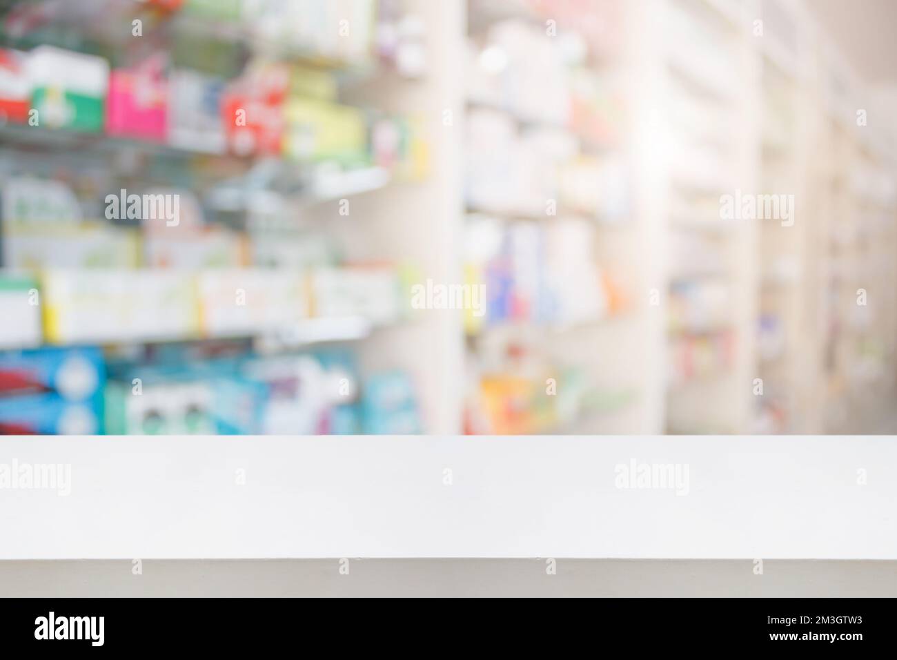 pharmacy store counter table top with blur medicine on shelves in the ...