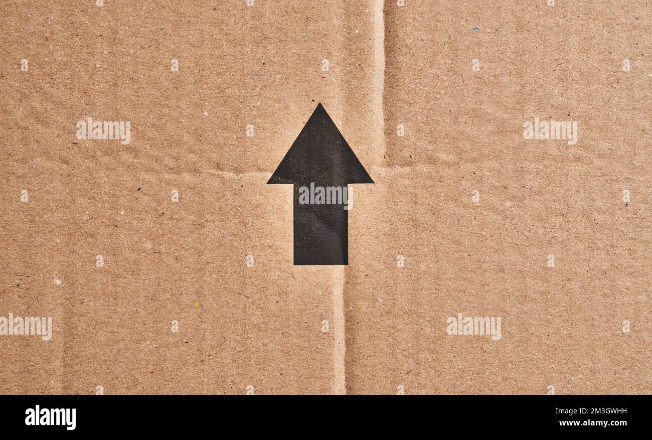 Brown cardboard carton material with arrow texture background Stock ...