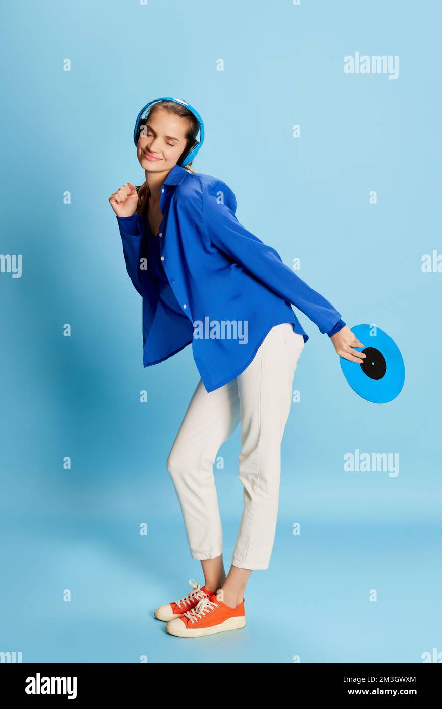 Portrait of beautiful young girl in stylish clothes posing in ...