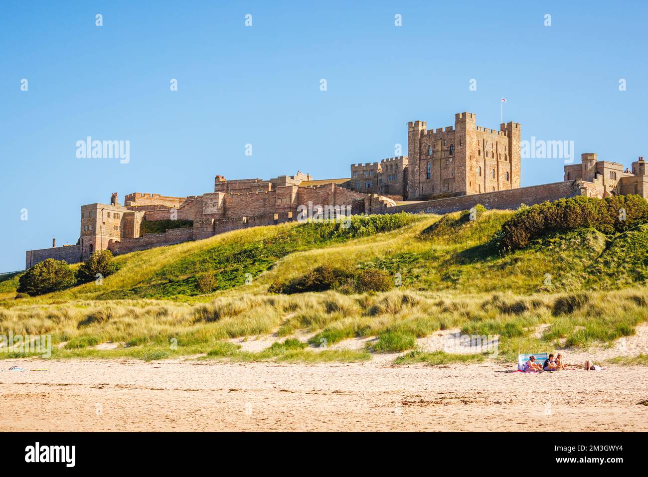 Iconic Bamburgh Castle seen from the beach on the north-east coast of ...