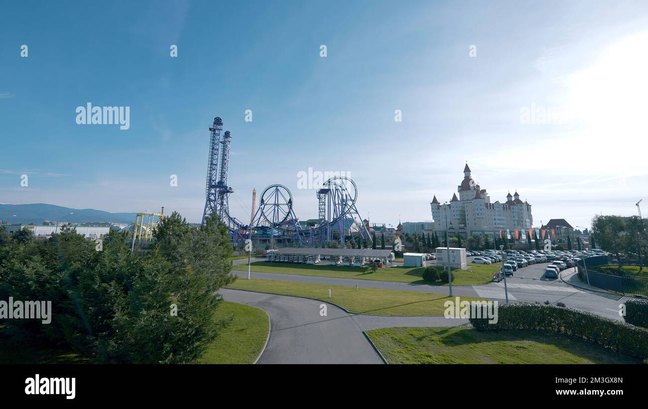 Disney-style amusement park. Action. Small amusement park with roller ...