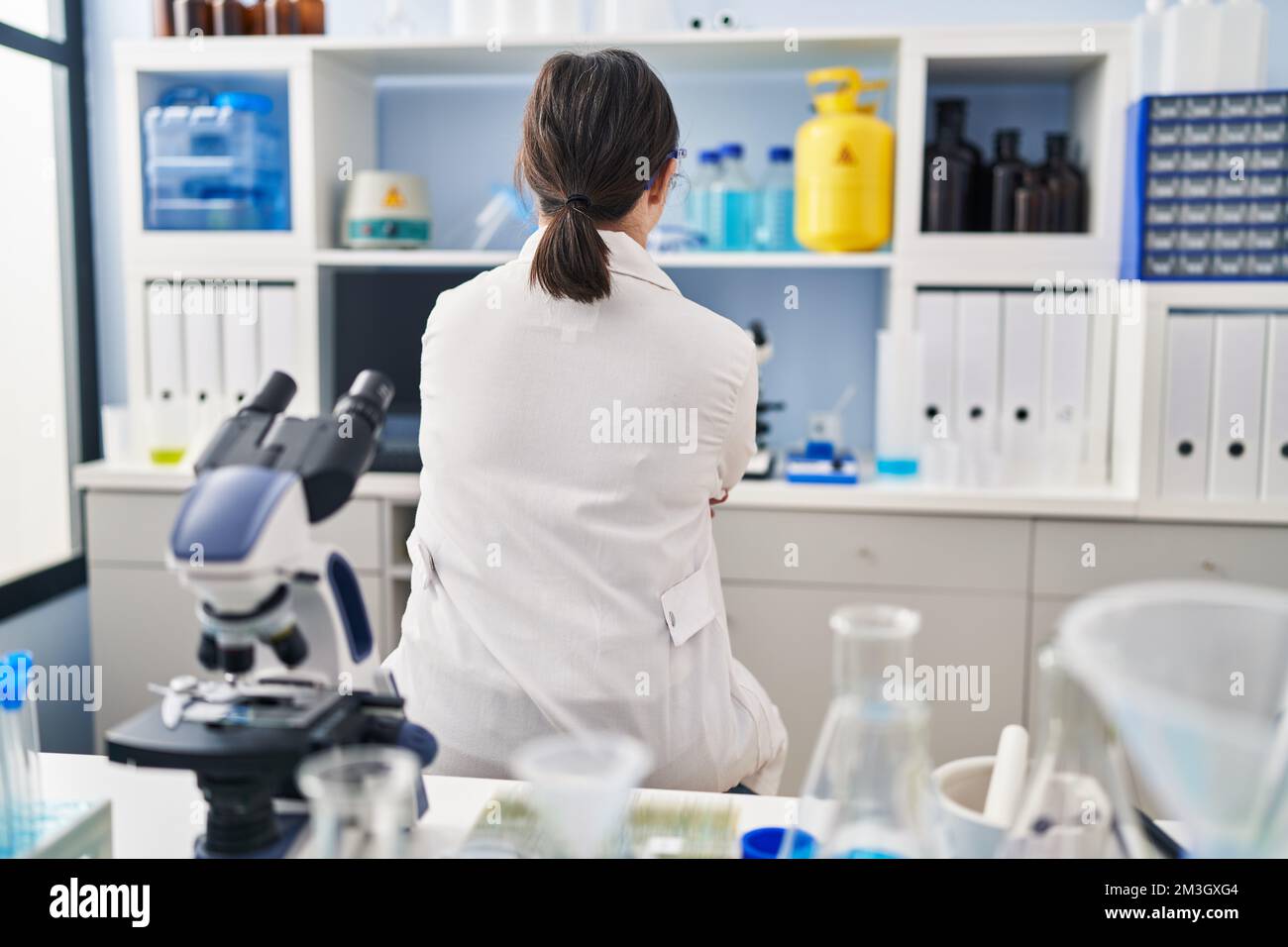 Hispanic girl with down syndrome working at scientist laboratory ...