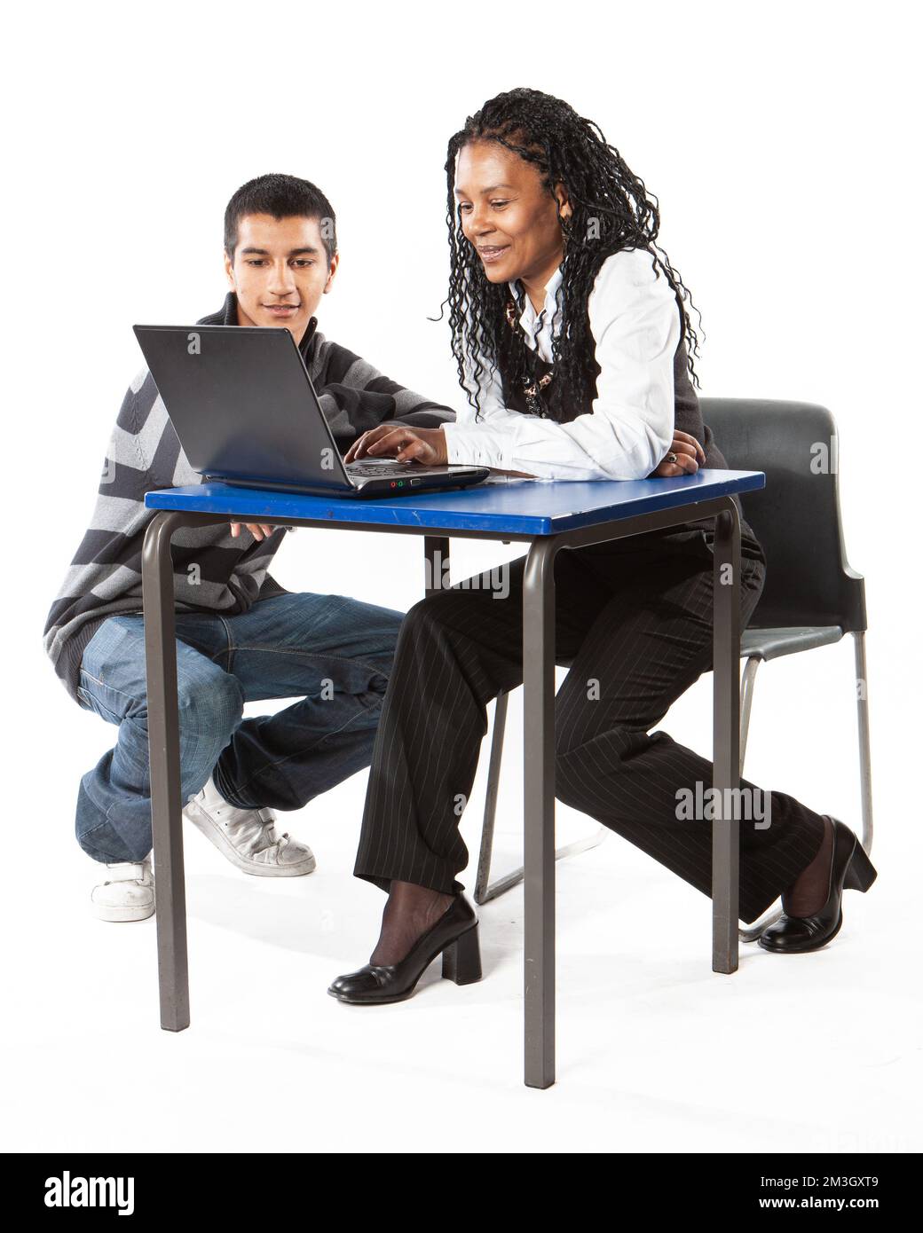 Teen boy computer teacher Cut Out Stock Images & Pictures - Alamy