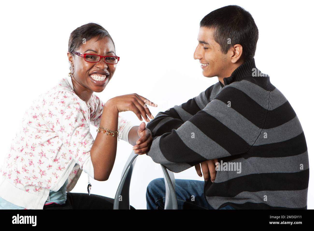 Teenage Students: Messing About. A pair of happy late-teenage friends ...