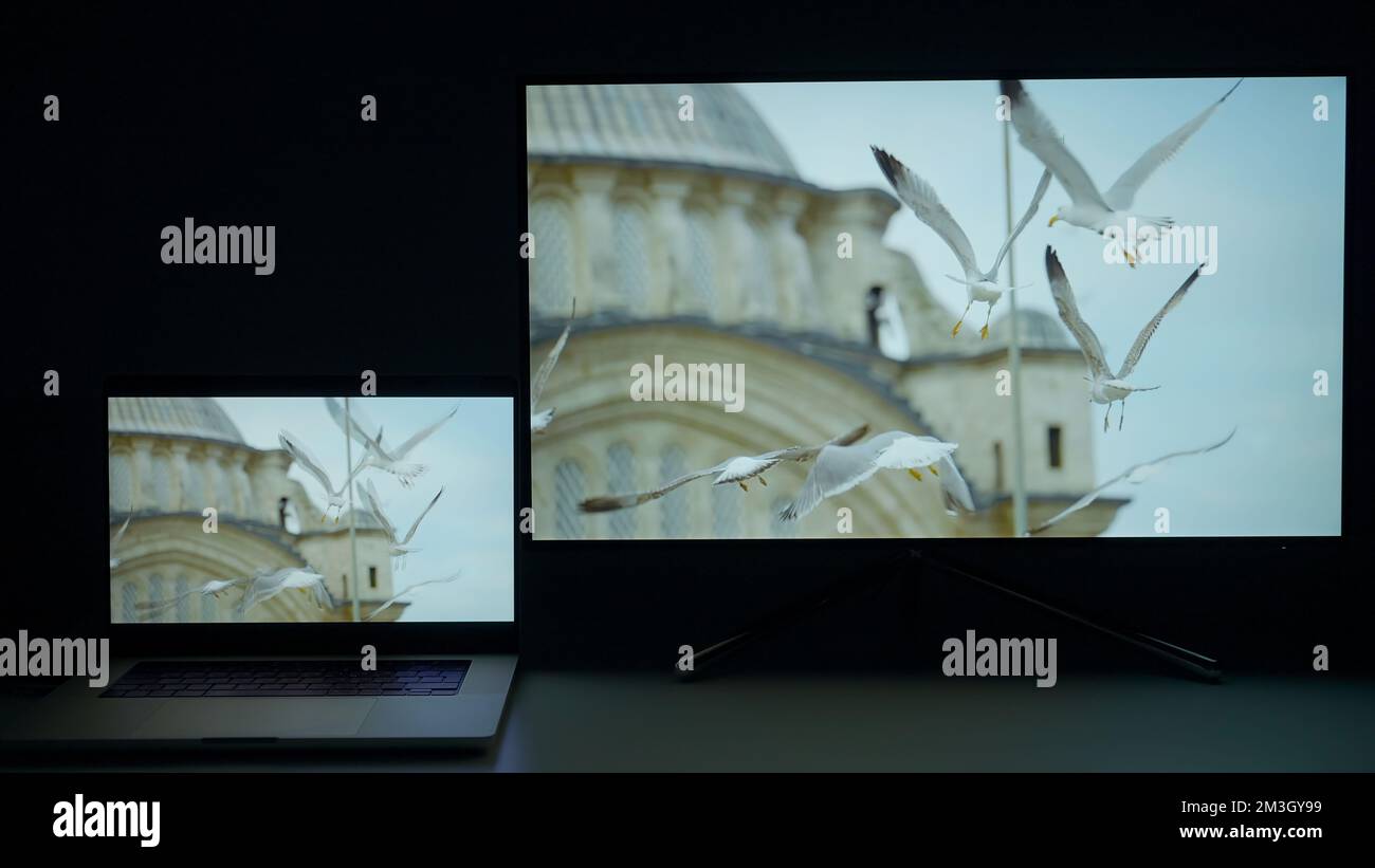 Device Quality comparison. Action. Video on laptop and computer monitor ...