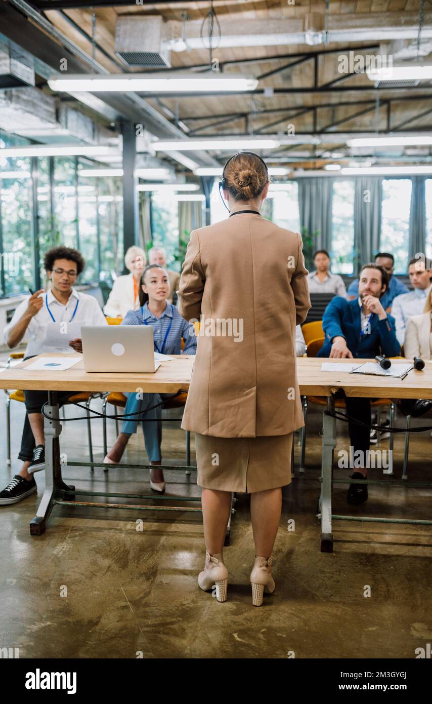 Cinematic image of a conference meeting. Business people sitting in a ...