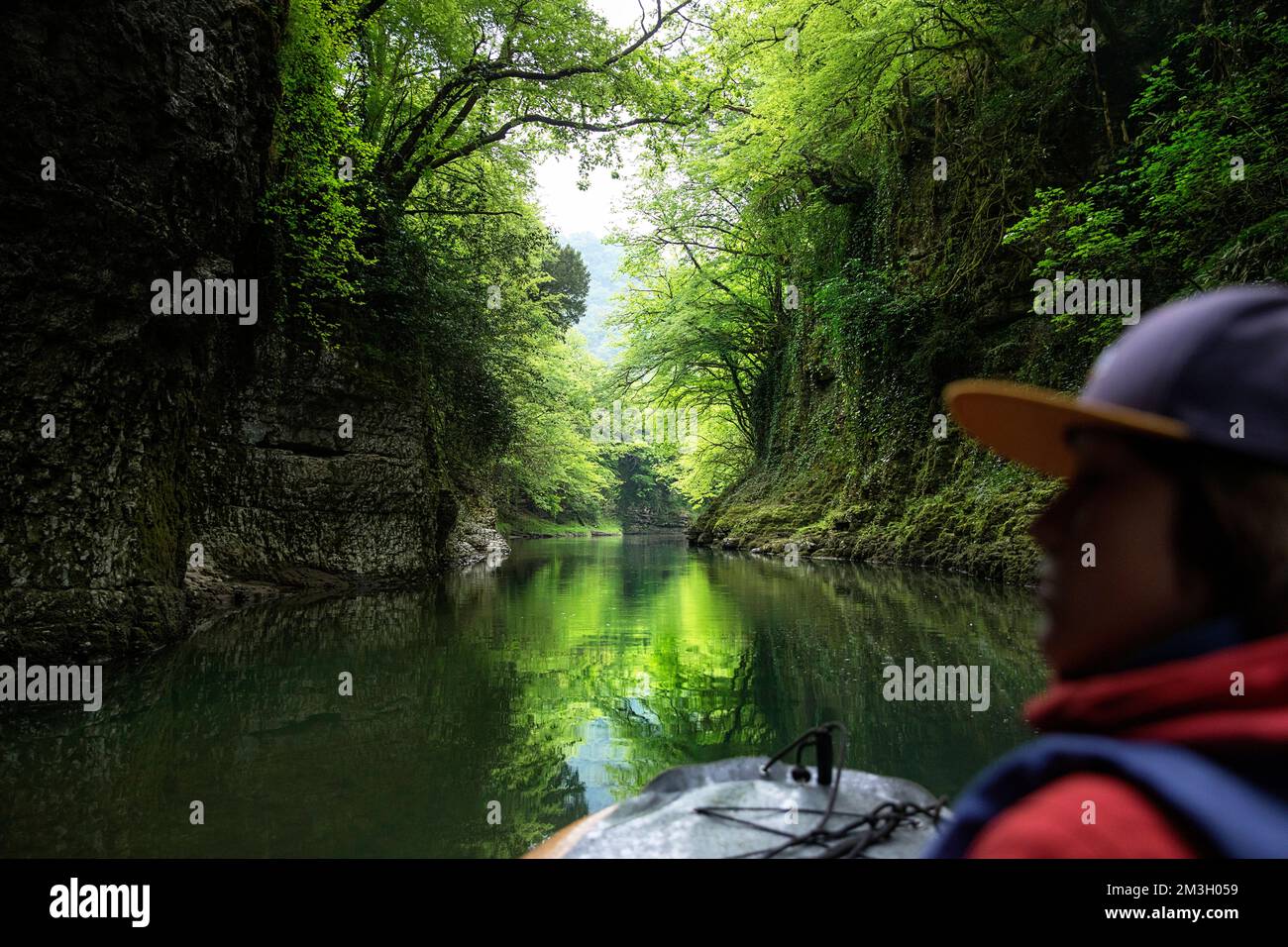 Boy tourist on a boat exploring beautiful Martvili canyon on Abasha ...