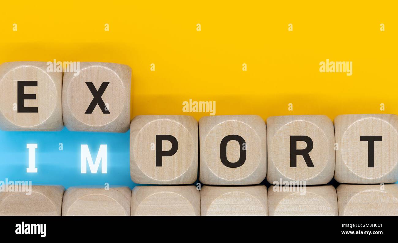 Import and export symbols. Combination of wooden cubes with the words ...