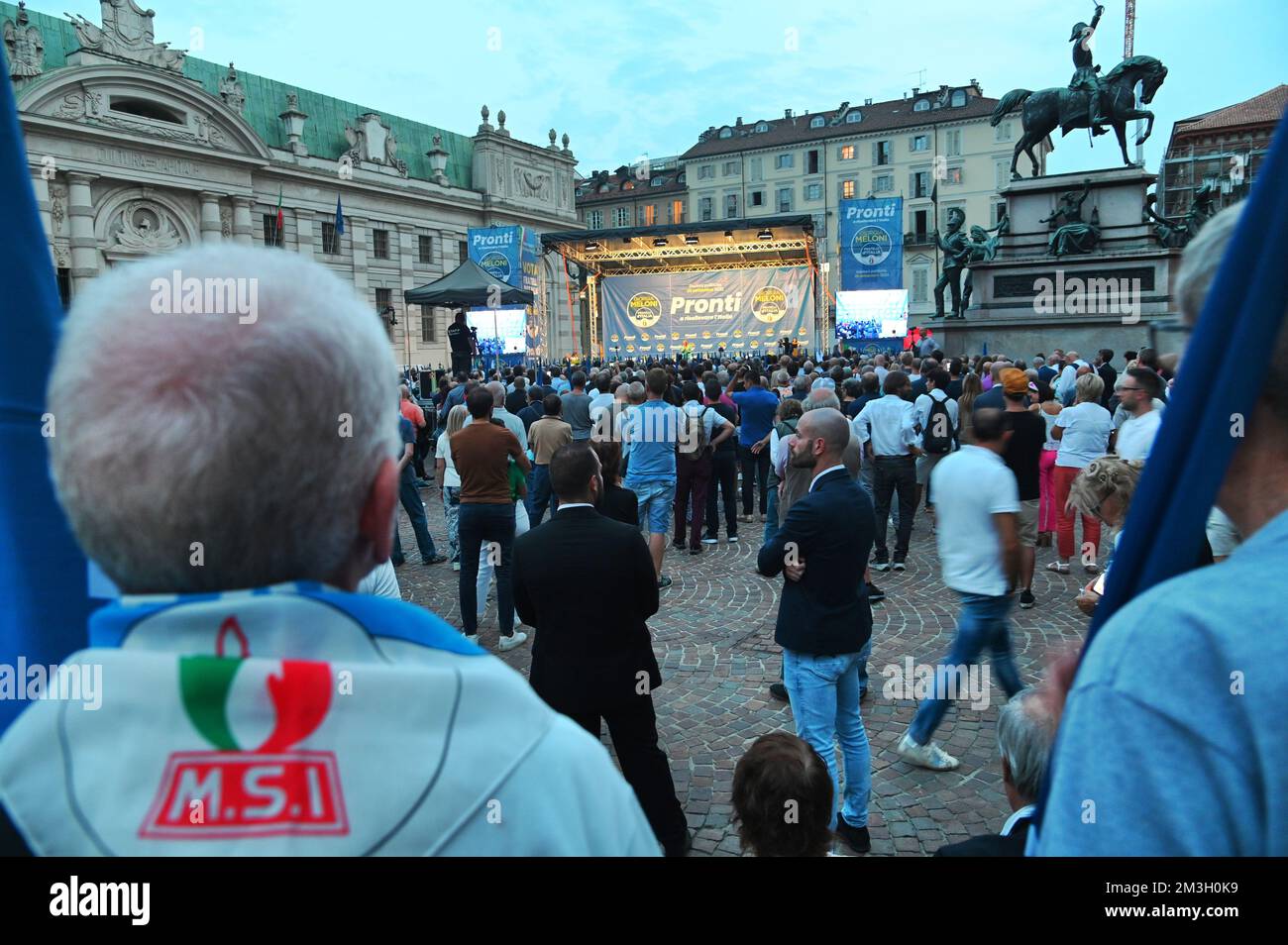 A man in white standing in the crowd during the campaign of "Fratelli d ...