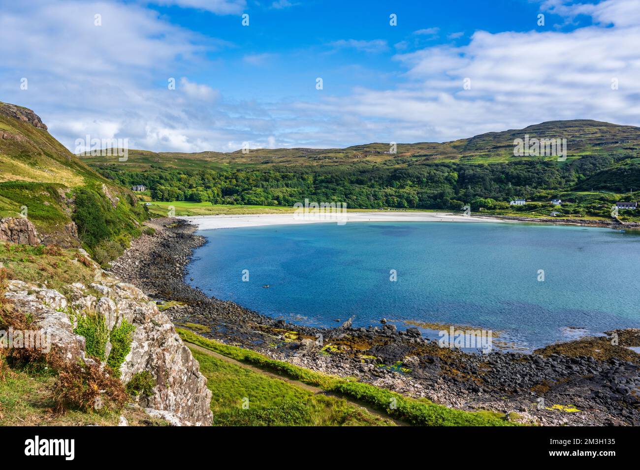 View looking down on Calgary Bay, with the expanse of white sand of ...