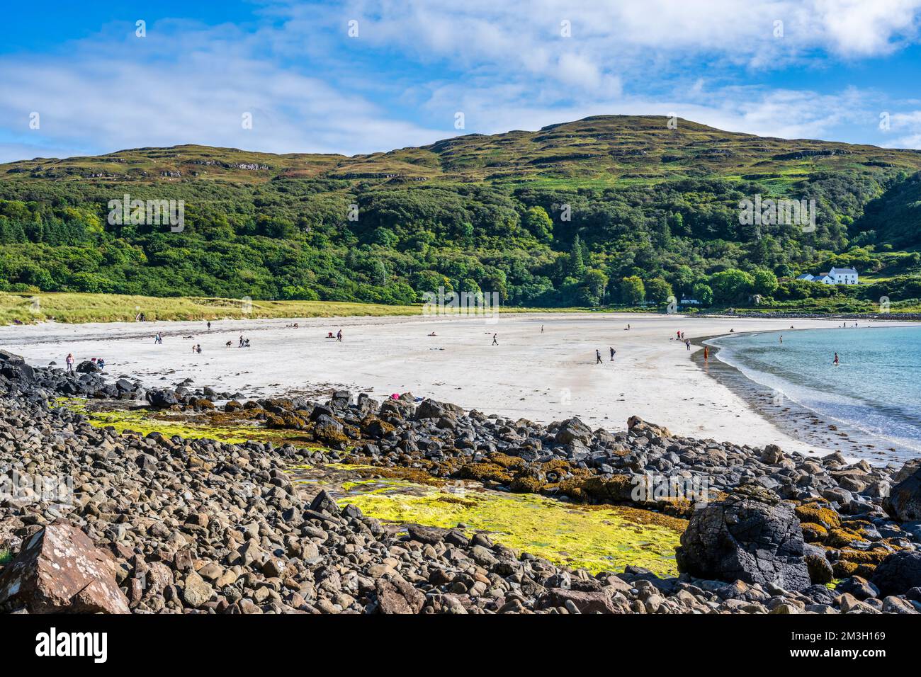 View of holidaymakers enjoying the summer sunshine on Calgary Beach on ...