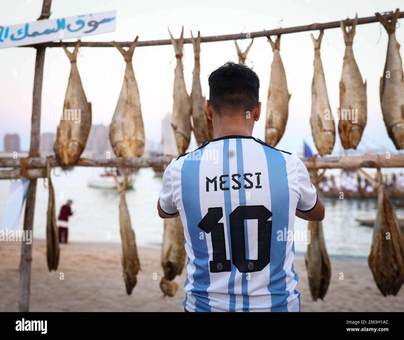Doha, Qatar, 15th November 2022. A local fisherman in a Messi shirt ...