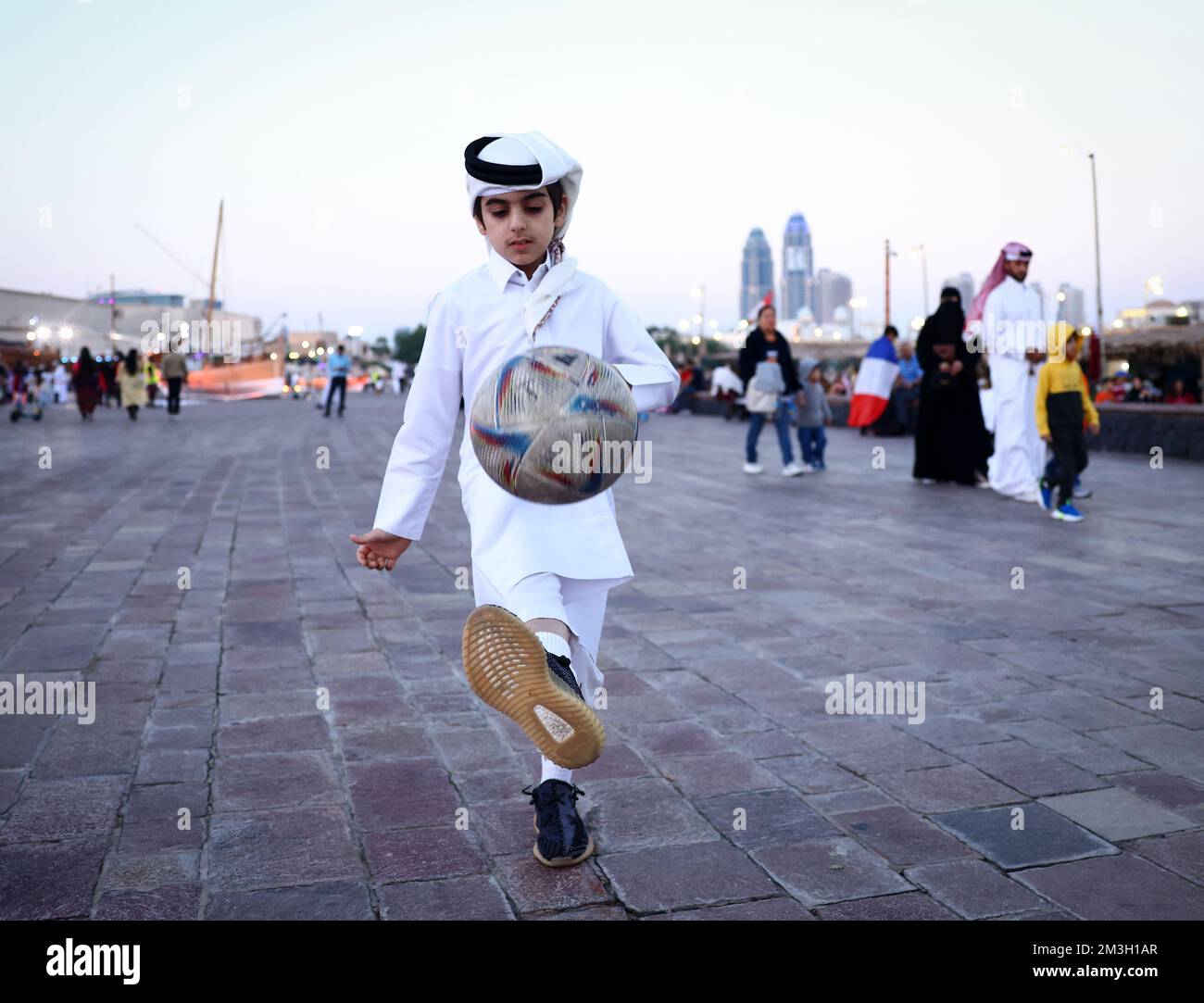 Doha, Qatar, 15th November 2022. A young boy in traditional dress poses ...