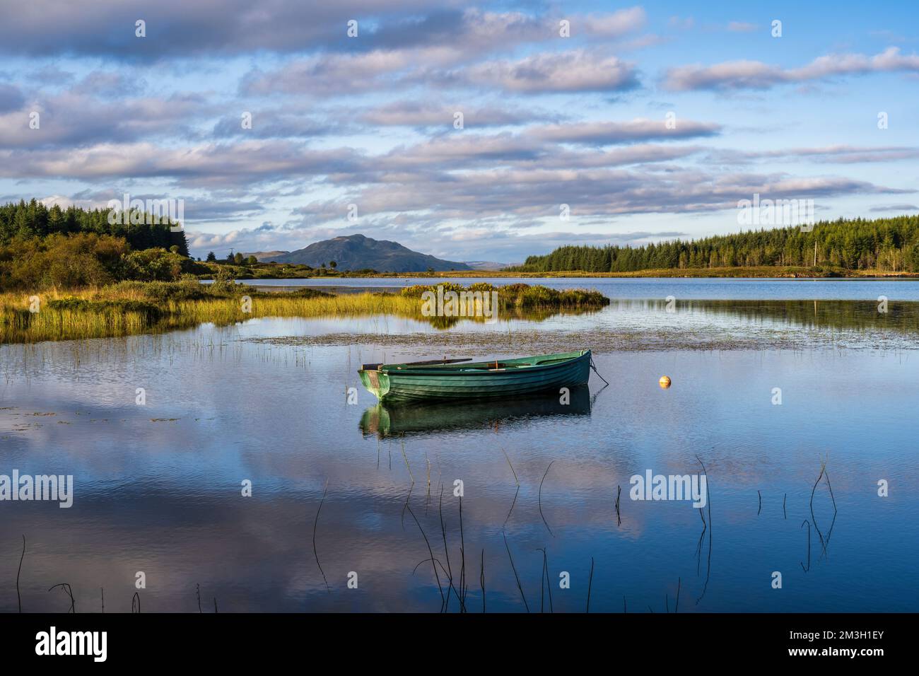 Fisherman’s boat on Loch Peallach, one of the three Mishnish Lochs ...