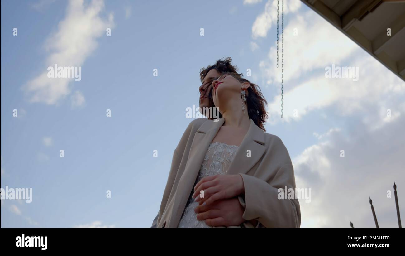 A couple embracing through the eyes of a photographer. Action.Newlyweds ...