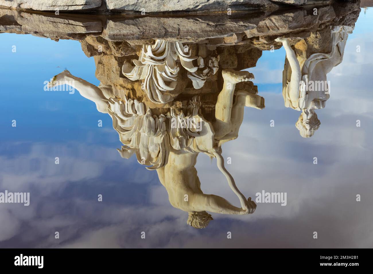 Statue reflections in a fountain Stock Photo - Alamy