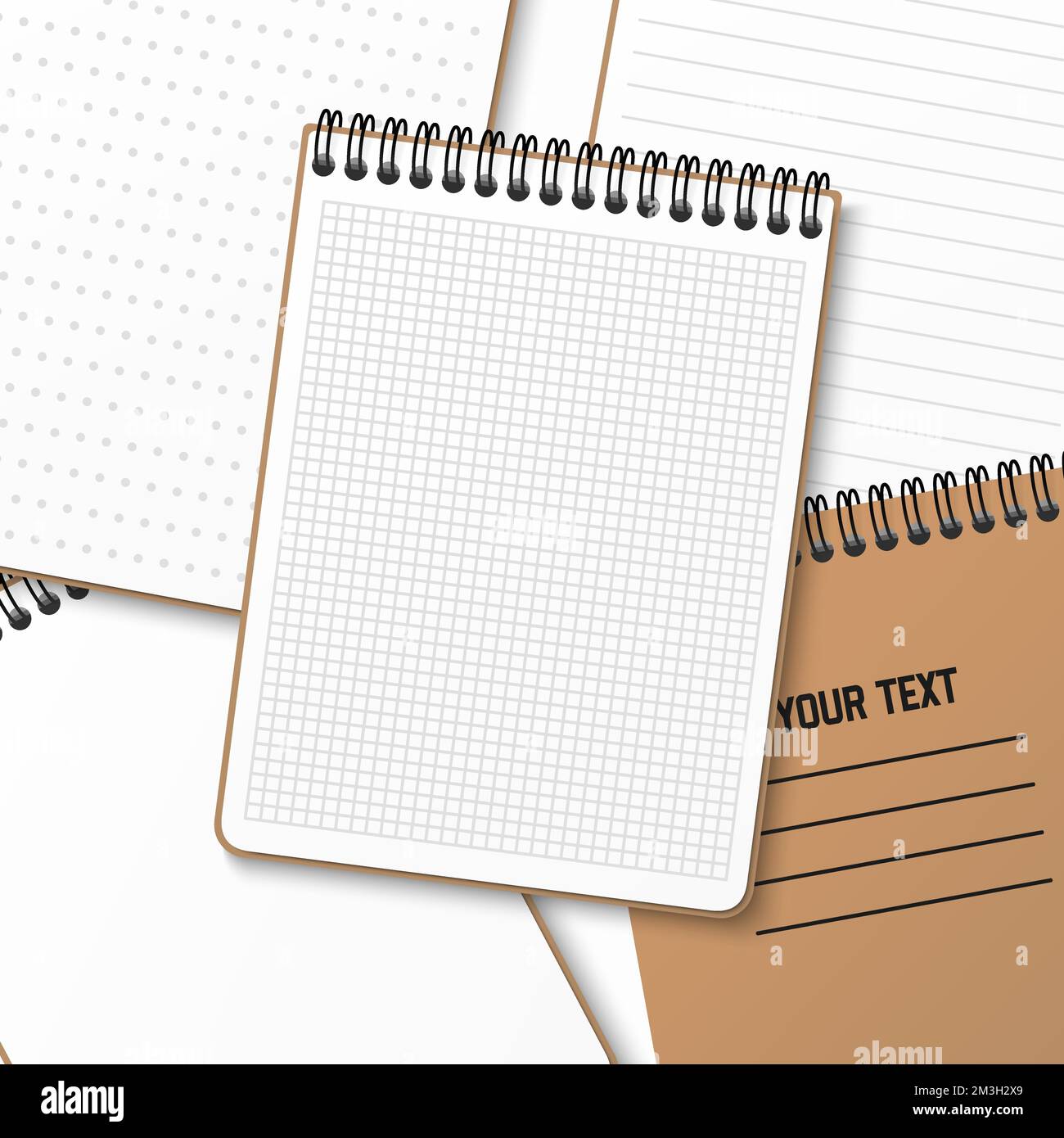 A notebook with a horizontal spring coil lies on top of another ...