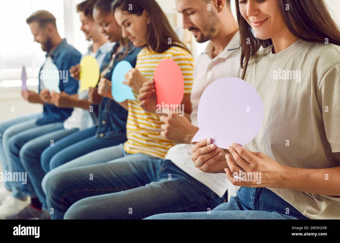 Group of diverse people taking part in opinion survey and showing mock ...