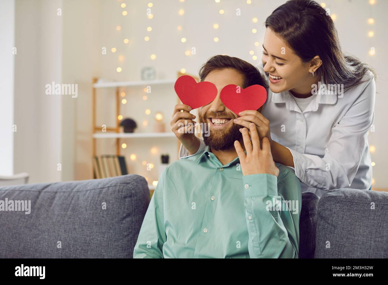 Happy, joyful man and woman in love make surprises and have fun on ...