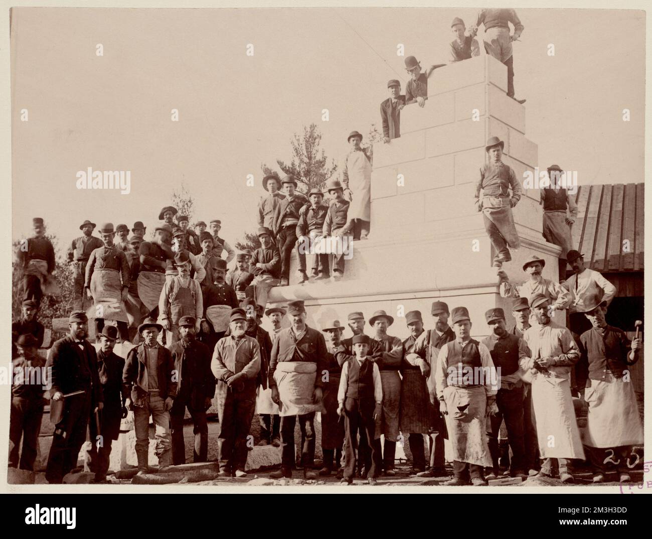 Milford Quarry workmen surround mock-up of cornerstone of McKim ...