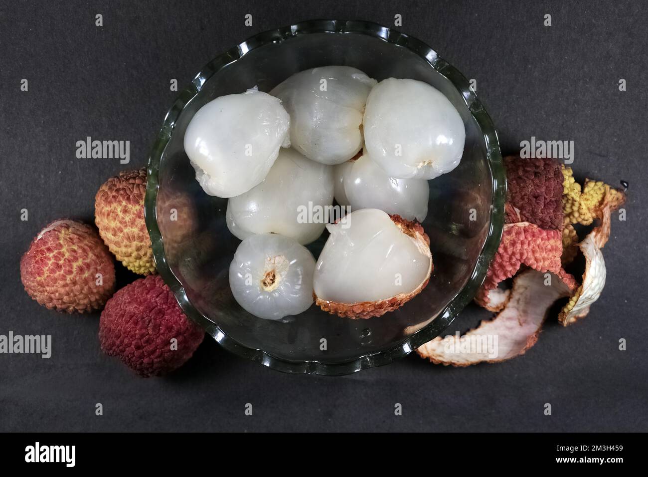 A top view of peeled lychee in a glass bowl Stock Photo - Alamy