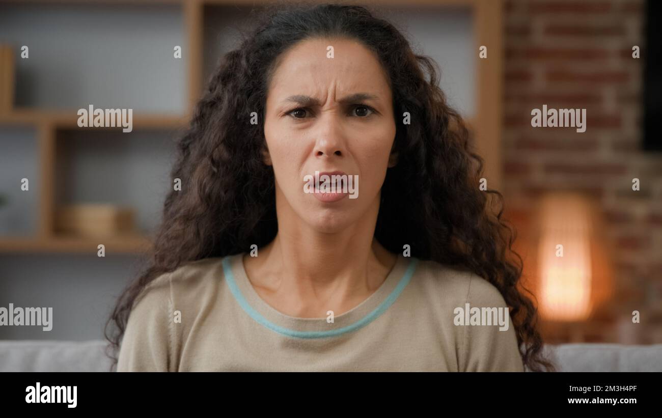 Portrait Hispanic Caucasian Woman Irritated Distraught Girl Sitting At Home Covers Ears With