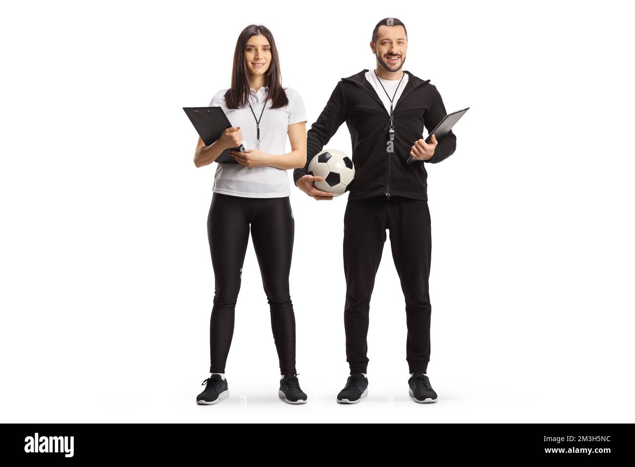 Full length portrait of a female and male foobtall coaches isolated on ...
