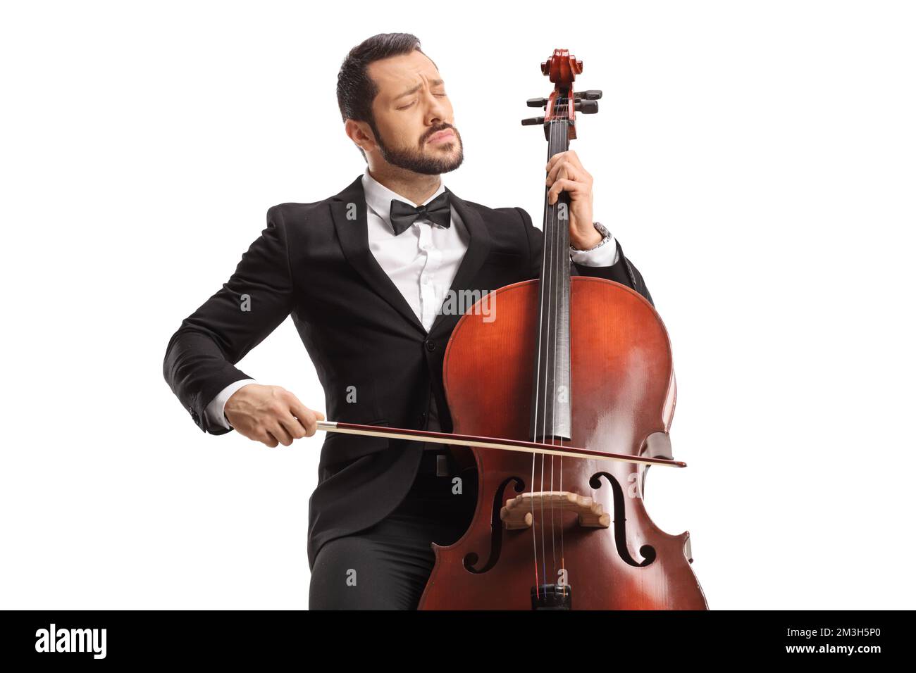 Male musician in a black suit and bow-tie performing with a cello ...