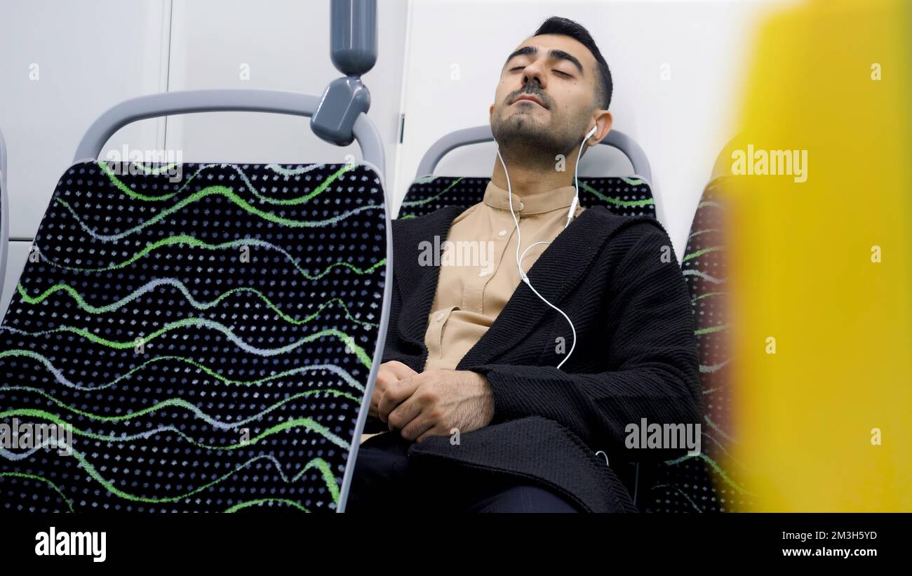 A man enjoying a ride. Media.A handsome man with stubble in office ...