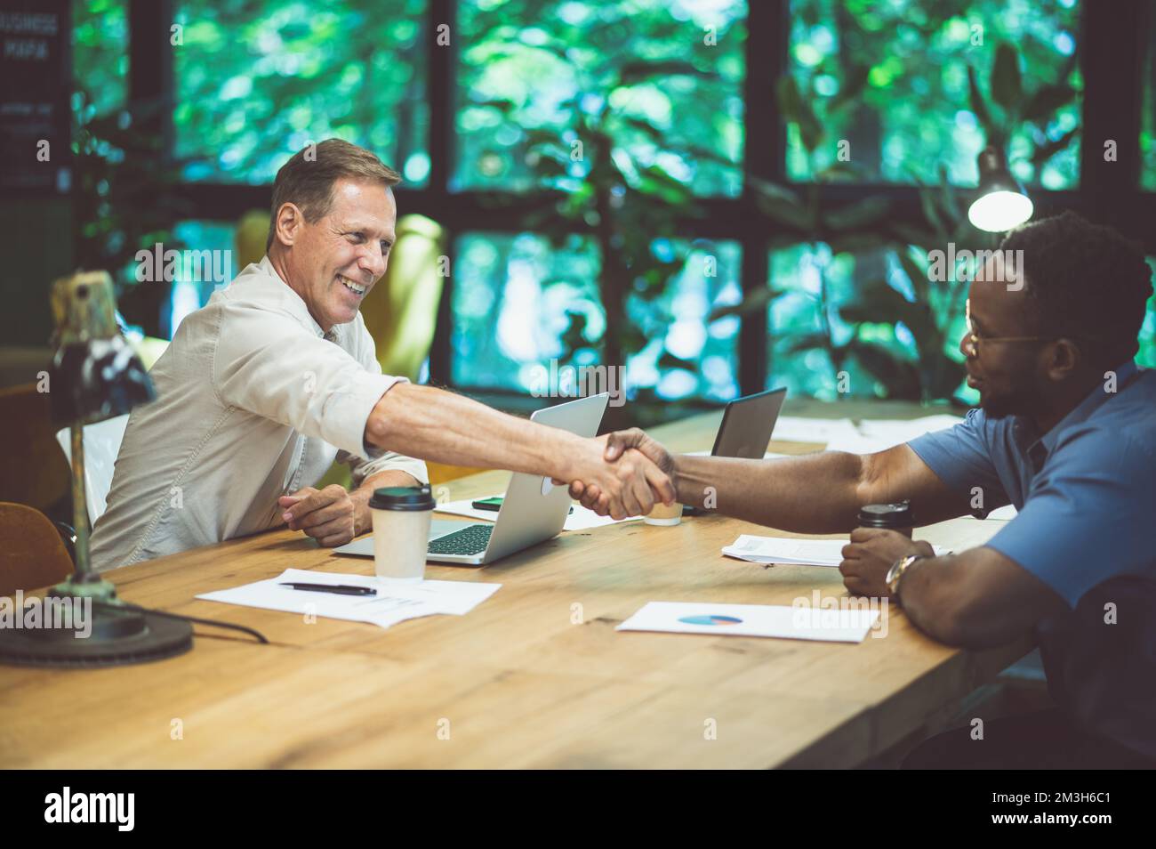 cinematic image of people working in a start up business. Multiethnic ...