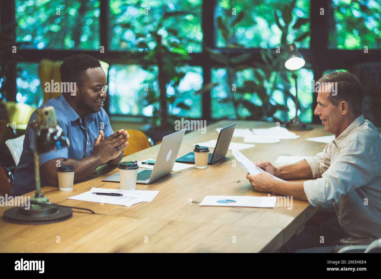 cinematic image of people working in a start up business. Multiethnic ...