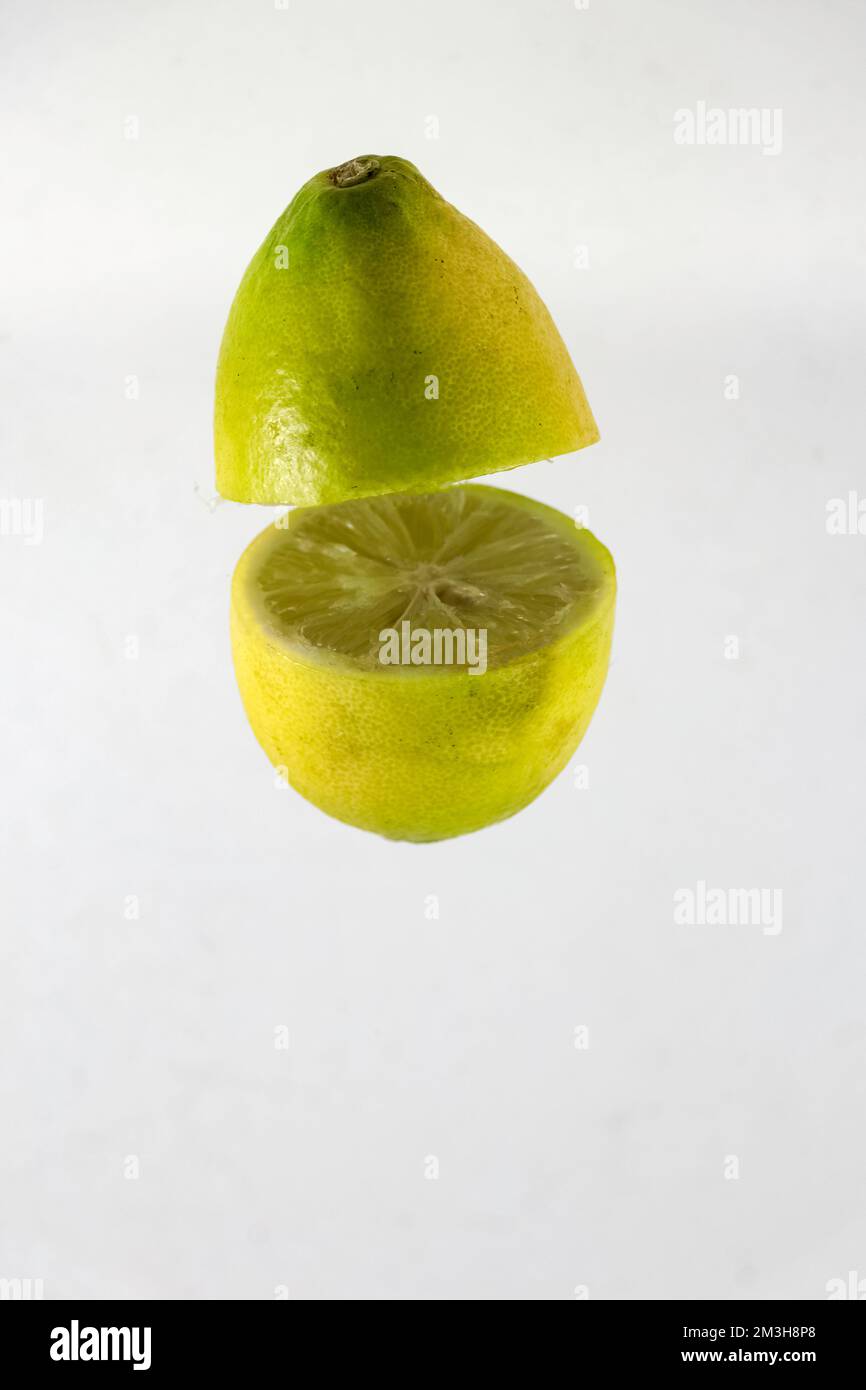 A cut lemon isolated on white background Stock Photo - Alamy