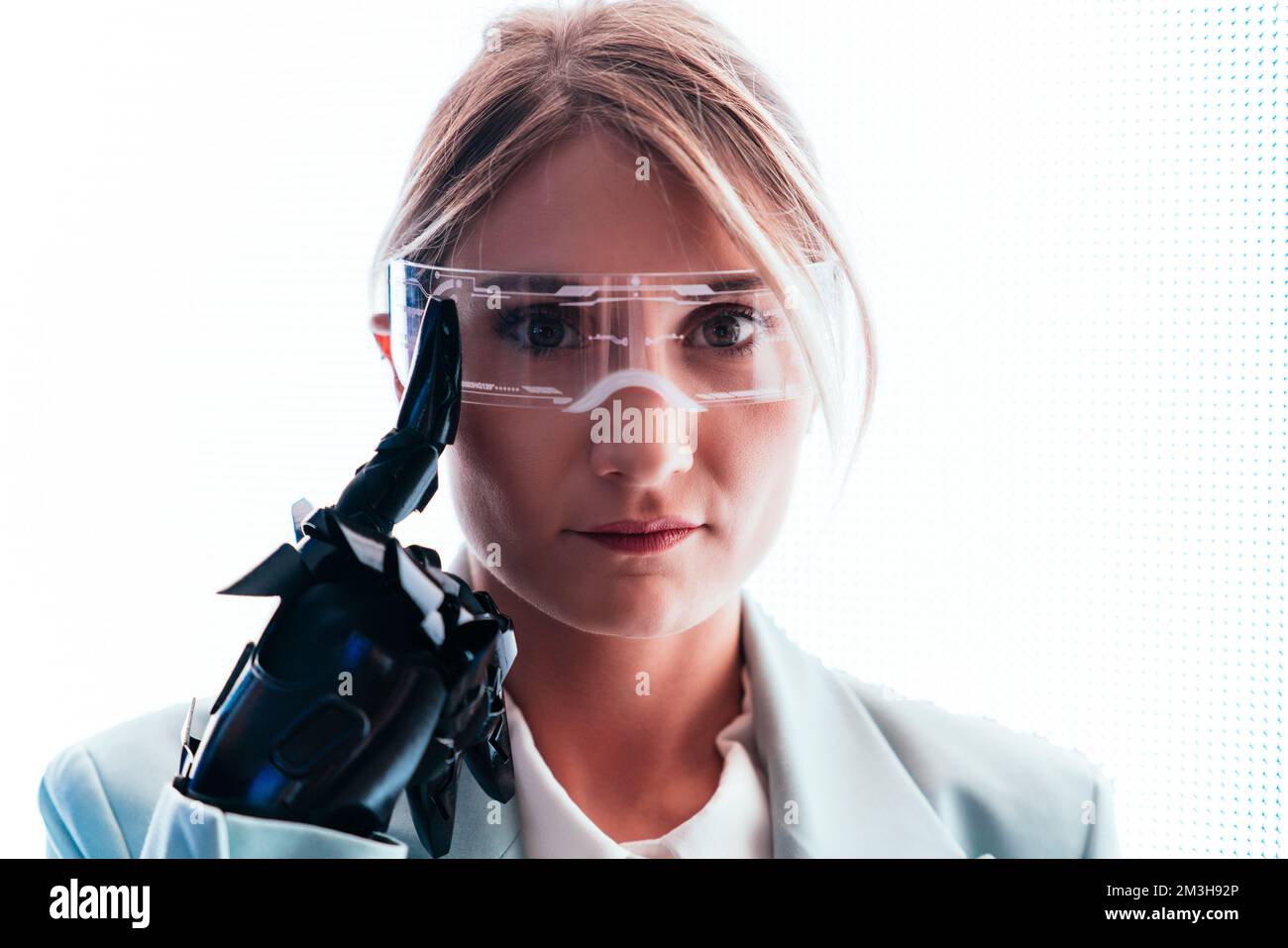 business woman with cyborg bionic arm and augmented reality visor ...