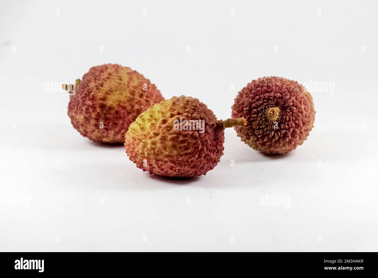 A bunch of pink lychee fruit isolated on white background Stock Photo ...