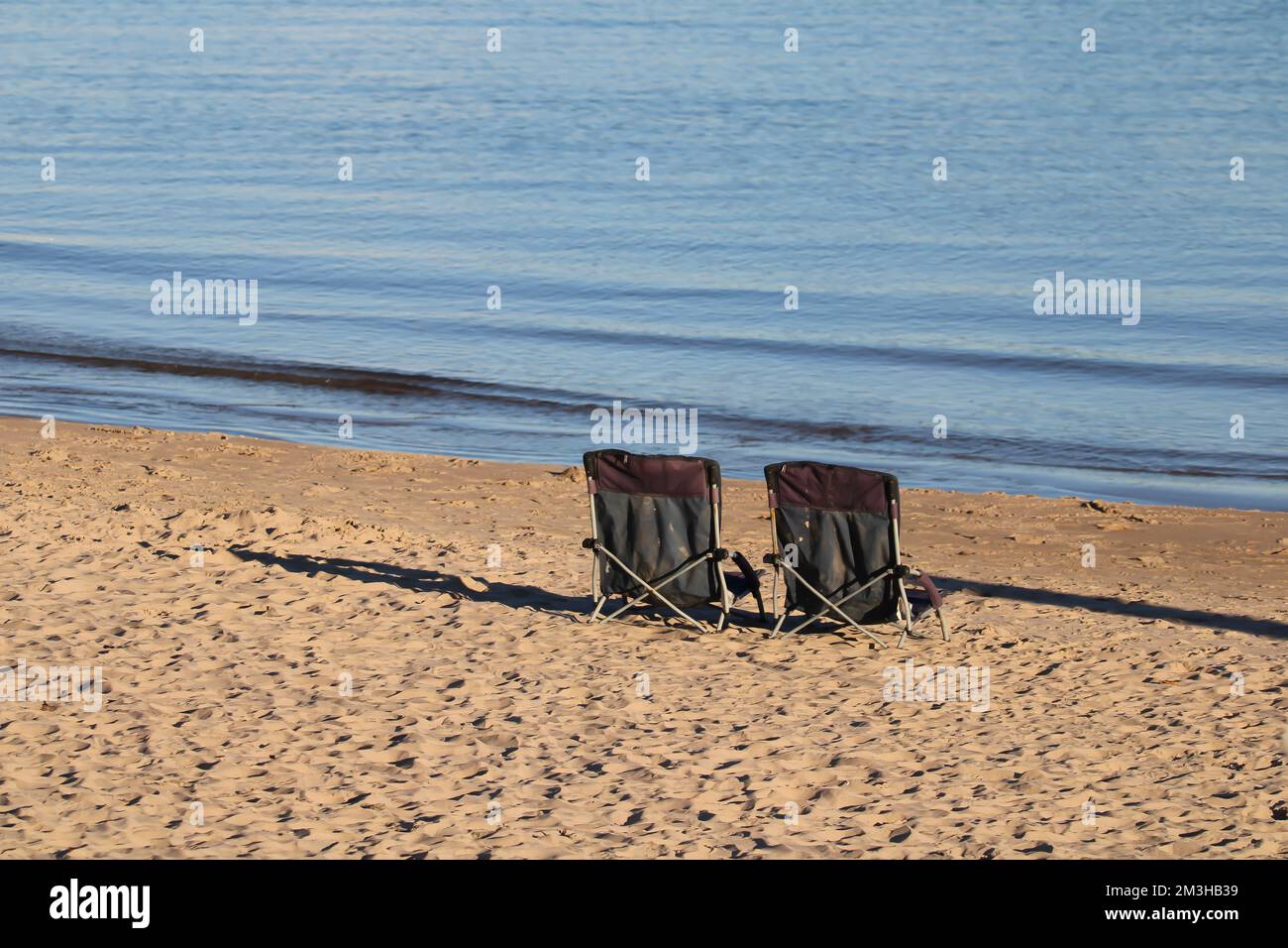 Two Lone Chairs on Lake Michigan Beach Stock Photo - Alamy