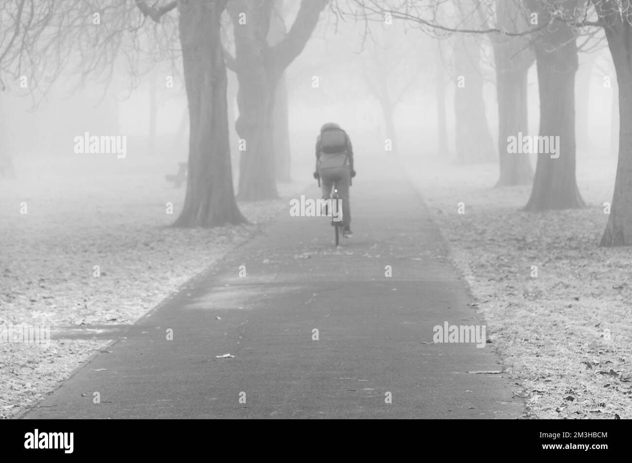Thick fog in the early morning as people walking, jogger run in London ...