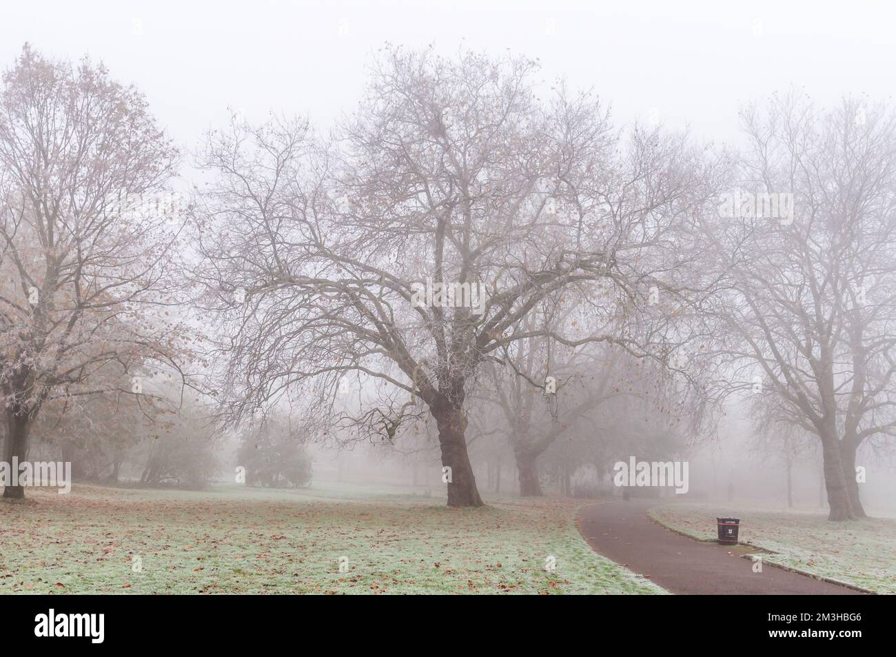 Thick fog in the early morning as people walking, jogger run in London ...