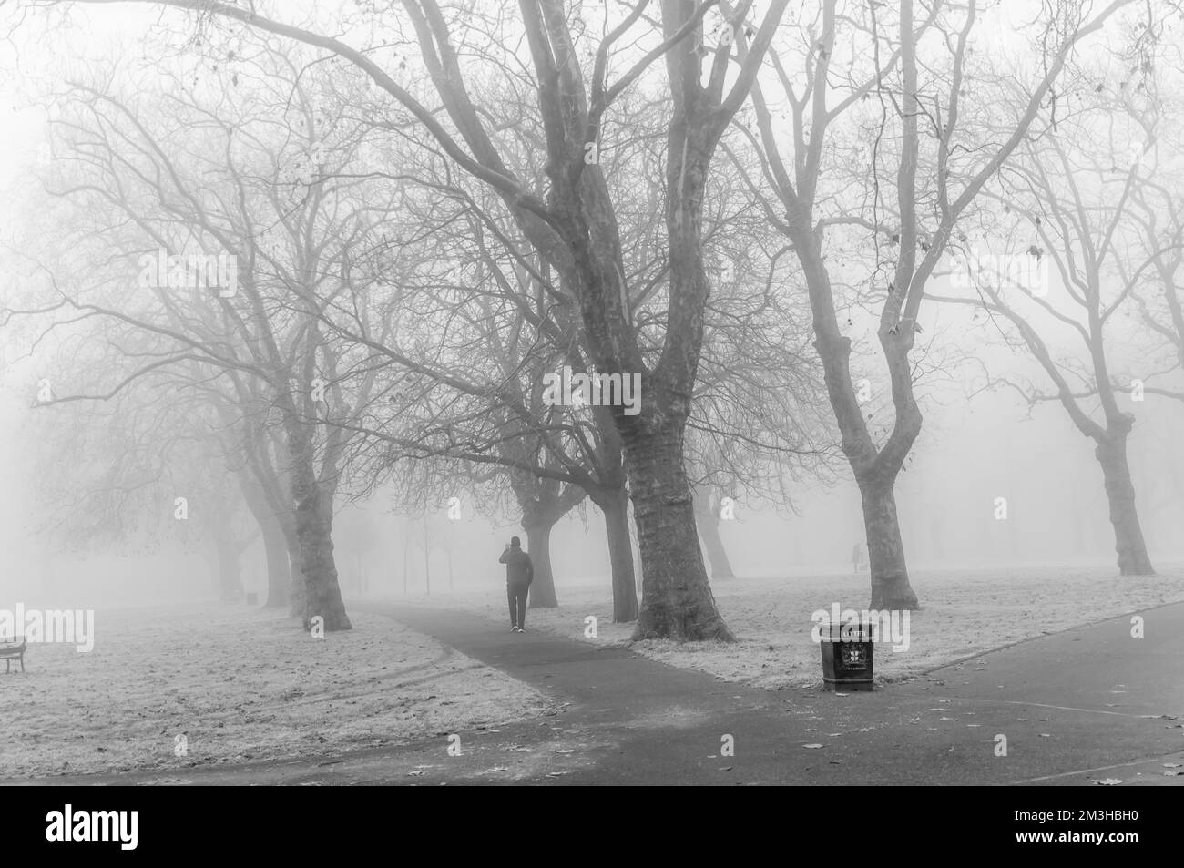 Thick fog in the early morning as people walking, jogger run in London ...