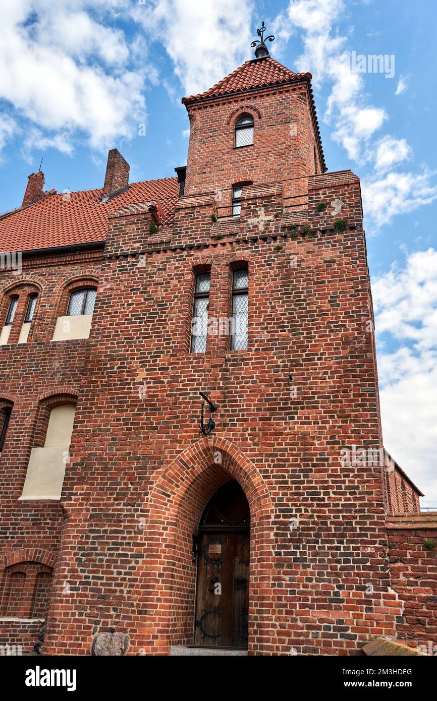 medieval brick walls and a historic tenement house in the city of Torun ...