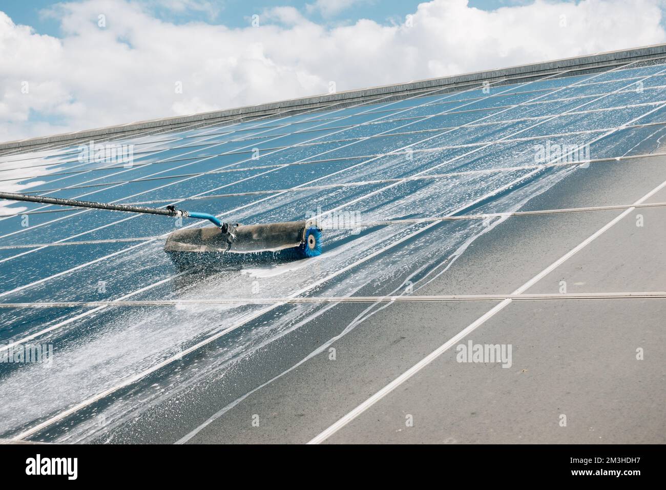 A close-up shot of solar system panel cleaning process Stock Photo - Alamy