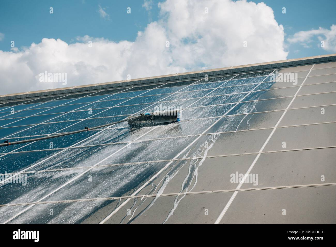 A close-up shot of solar system panel cleaning process Stock Photo - Alamy