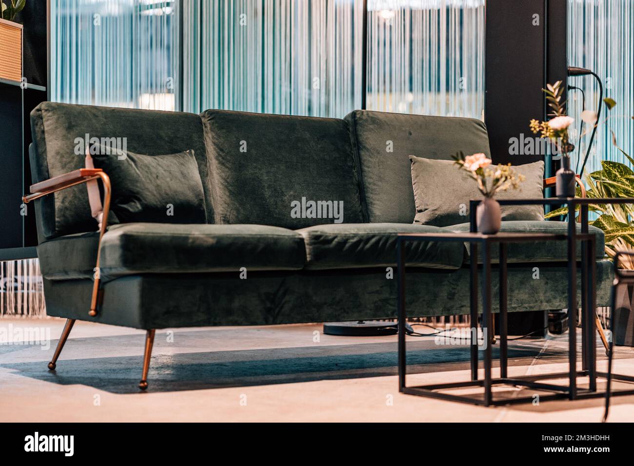 A closeup of a comfortable black sofa in an empty living room Stock ...